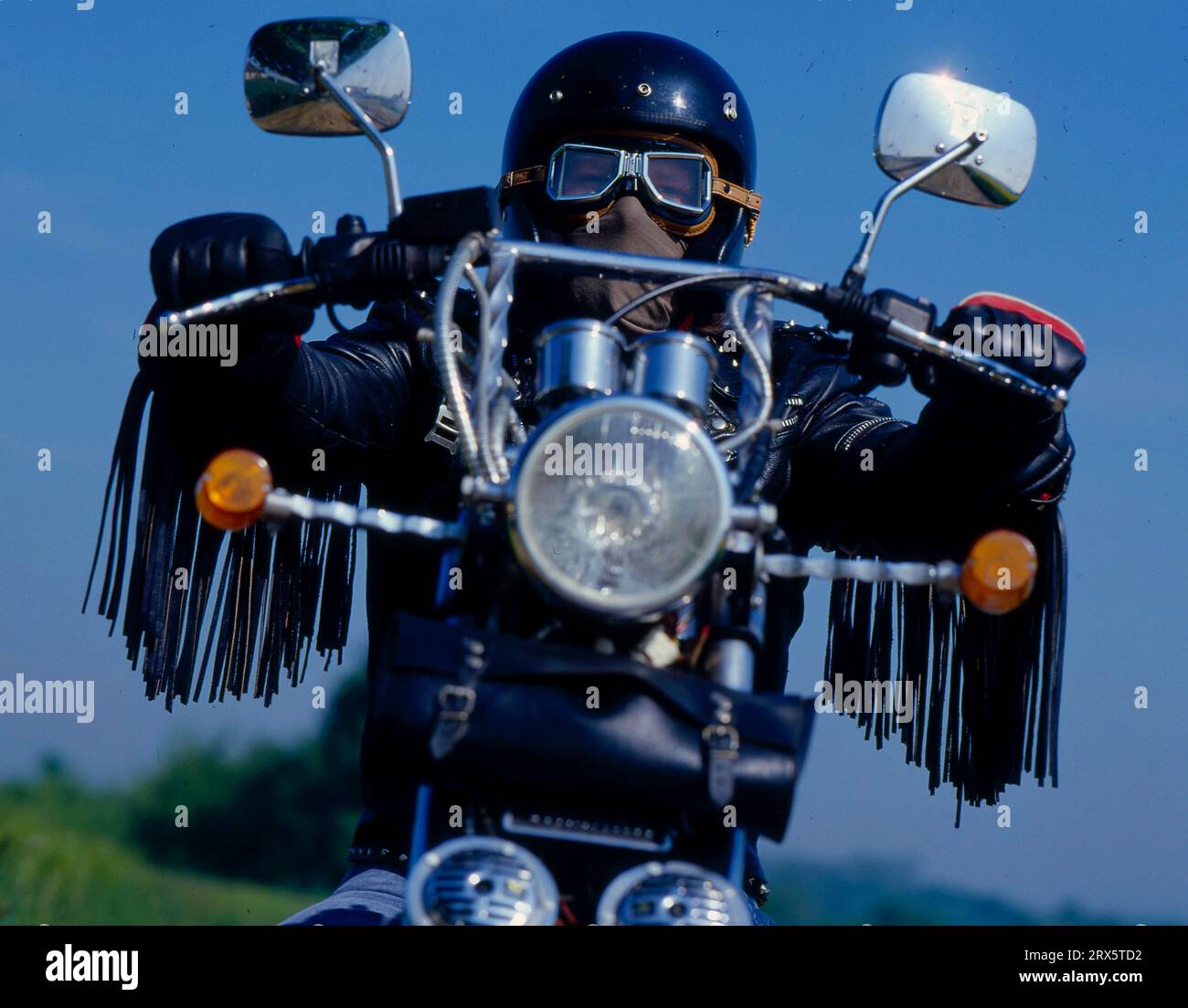 Chopper, Cooper, motorcyclist in black suit Stock Photo - Alamy