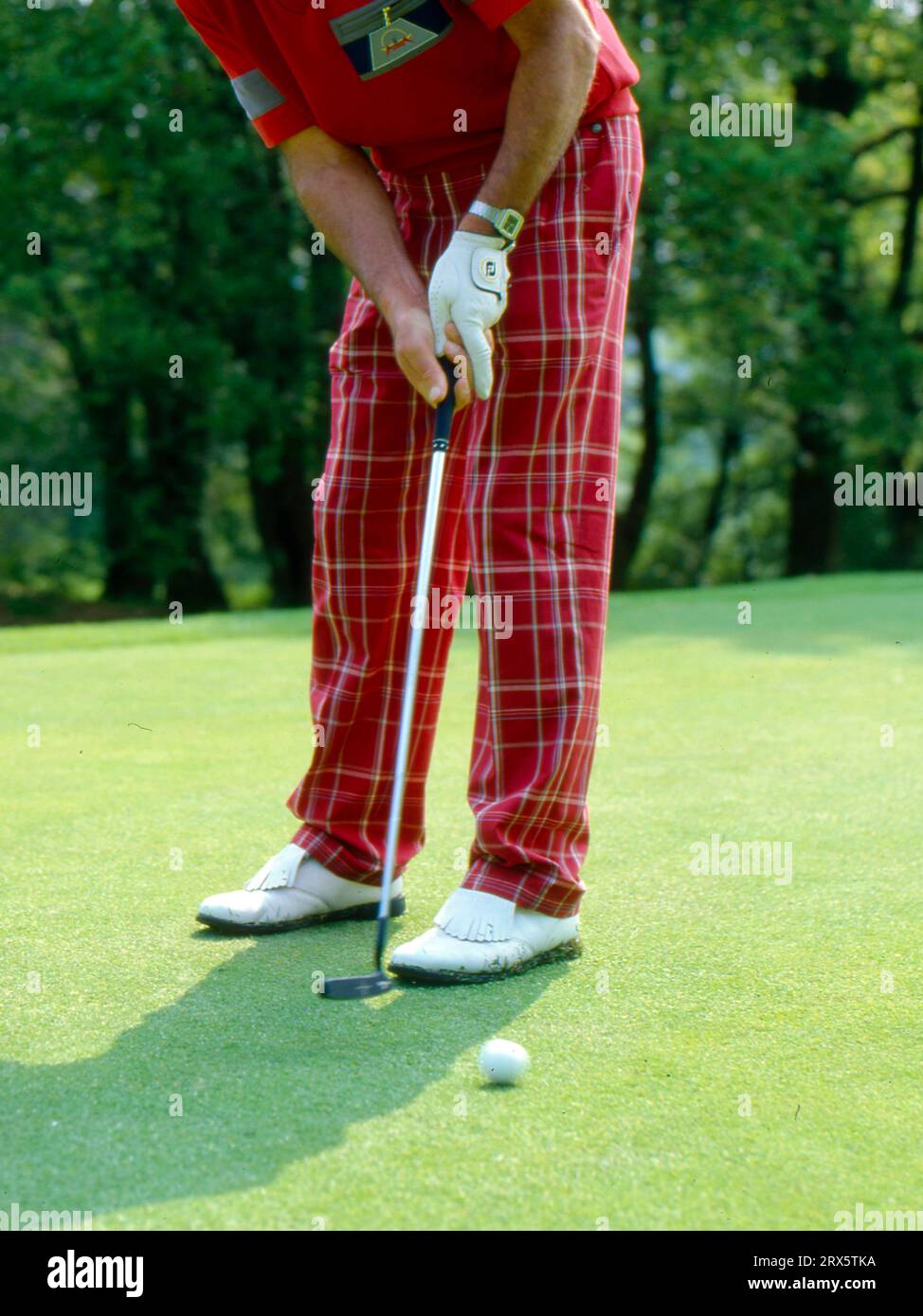 Man holing golf club hi-res stock photography and images - Alamy