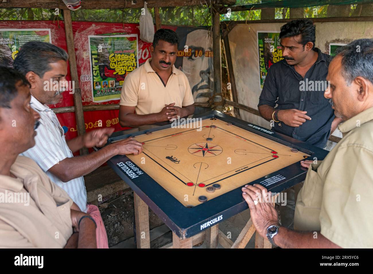 Indian man playing carrom board game, Munnar, Kerala, India Stock Photo ...