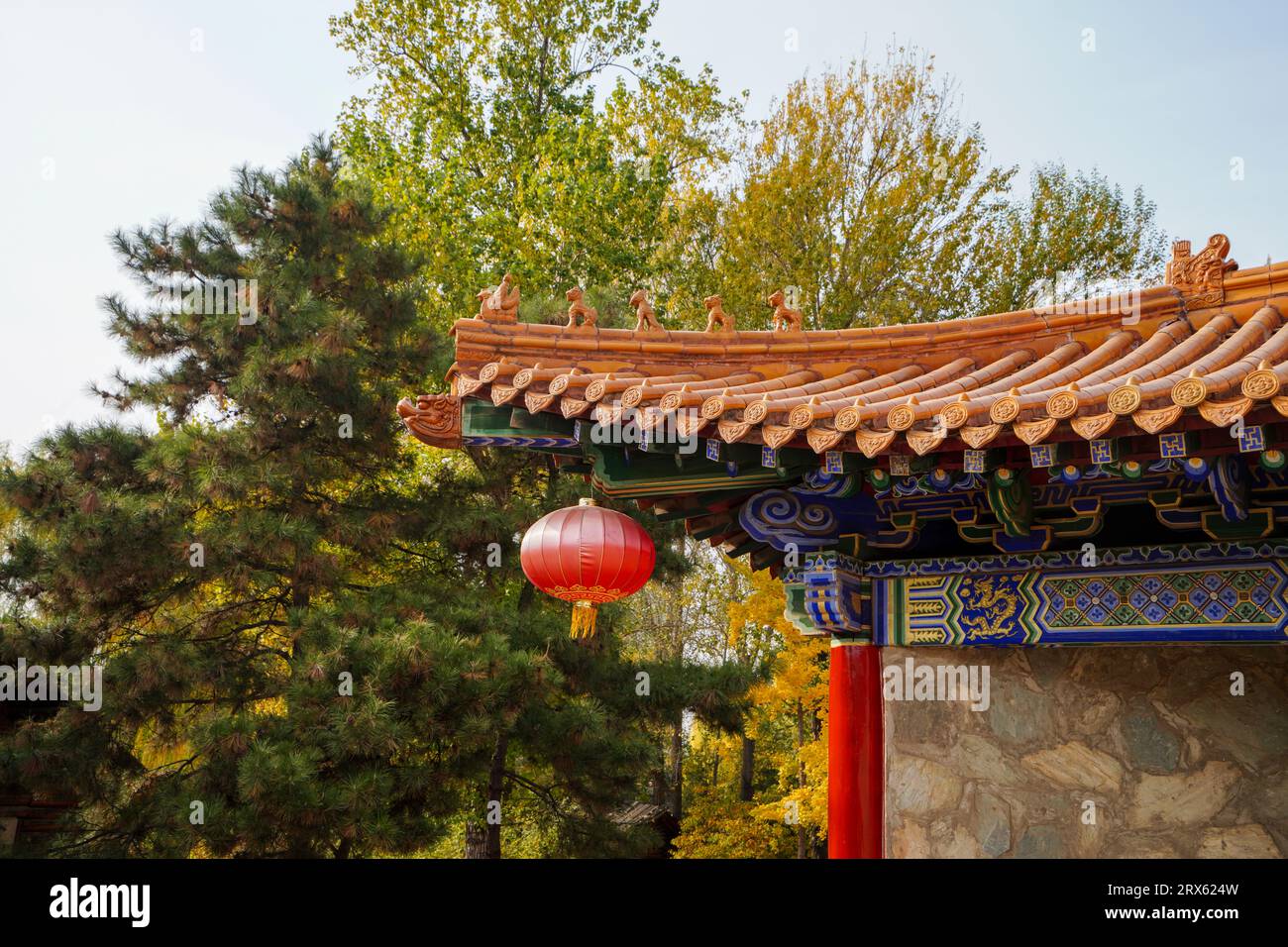 Yellow Chinese glazed roof tile buildings and red lanterns in ...
