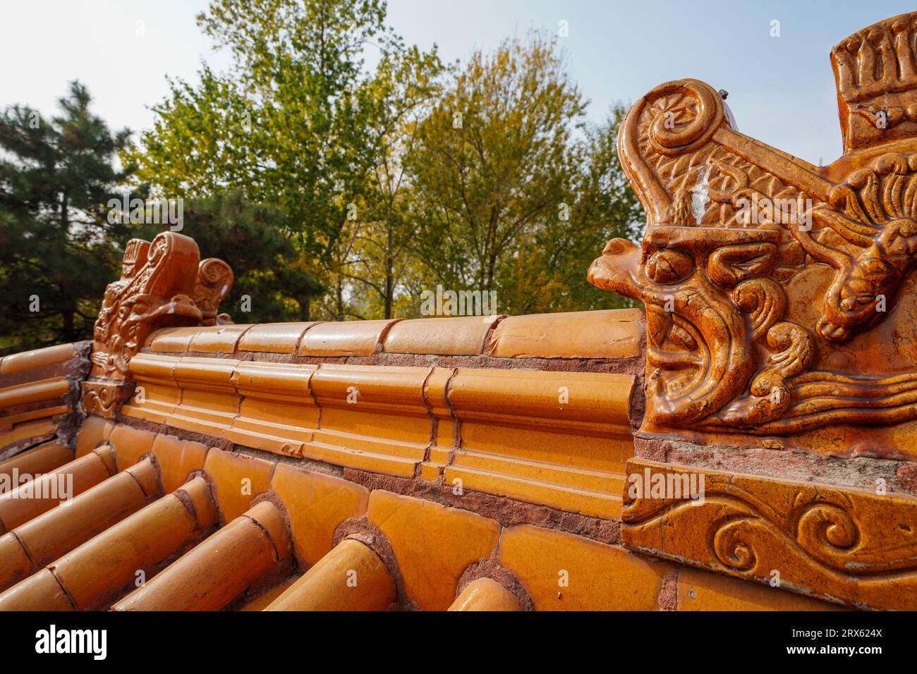 Yellow Chinese glazed roof tile dragon head architecture of Huangtangzi ...