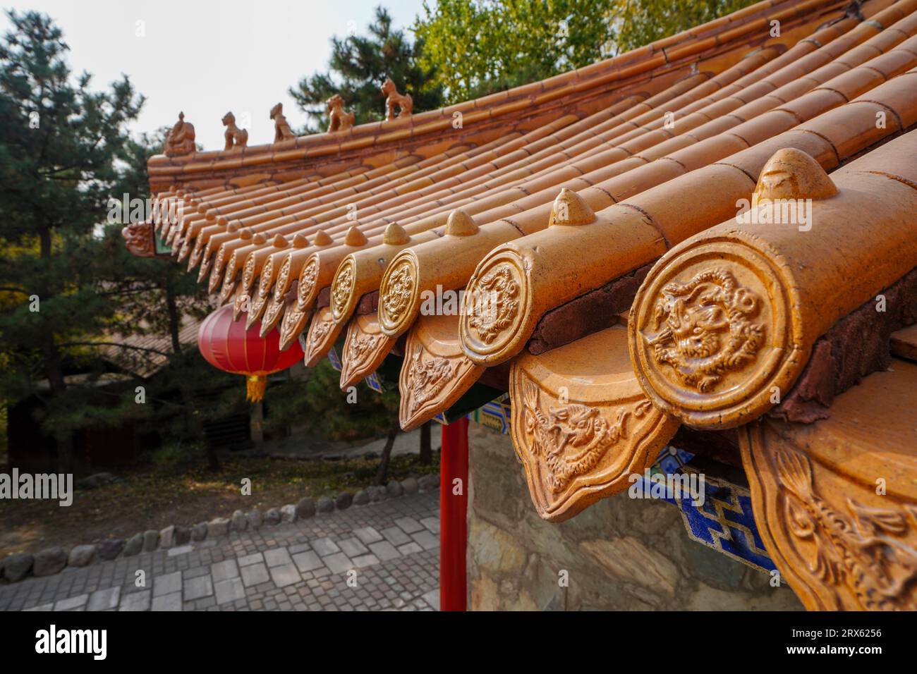 Yellow Chinese glazed roof tile buildings and red lanterns in ...