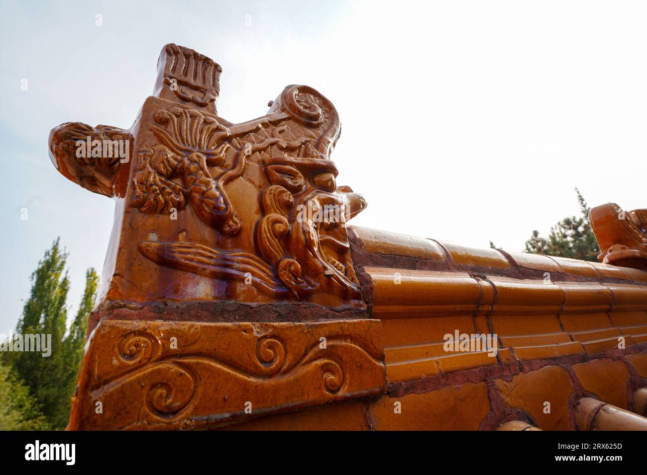 Yellow Chinese glazed roof tile dragon head architecture of Huangtangzi ...