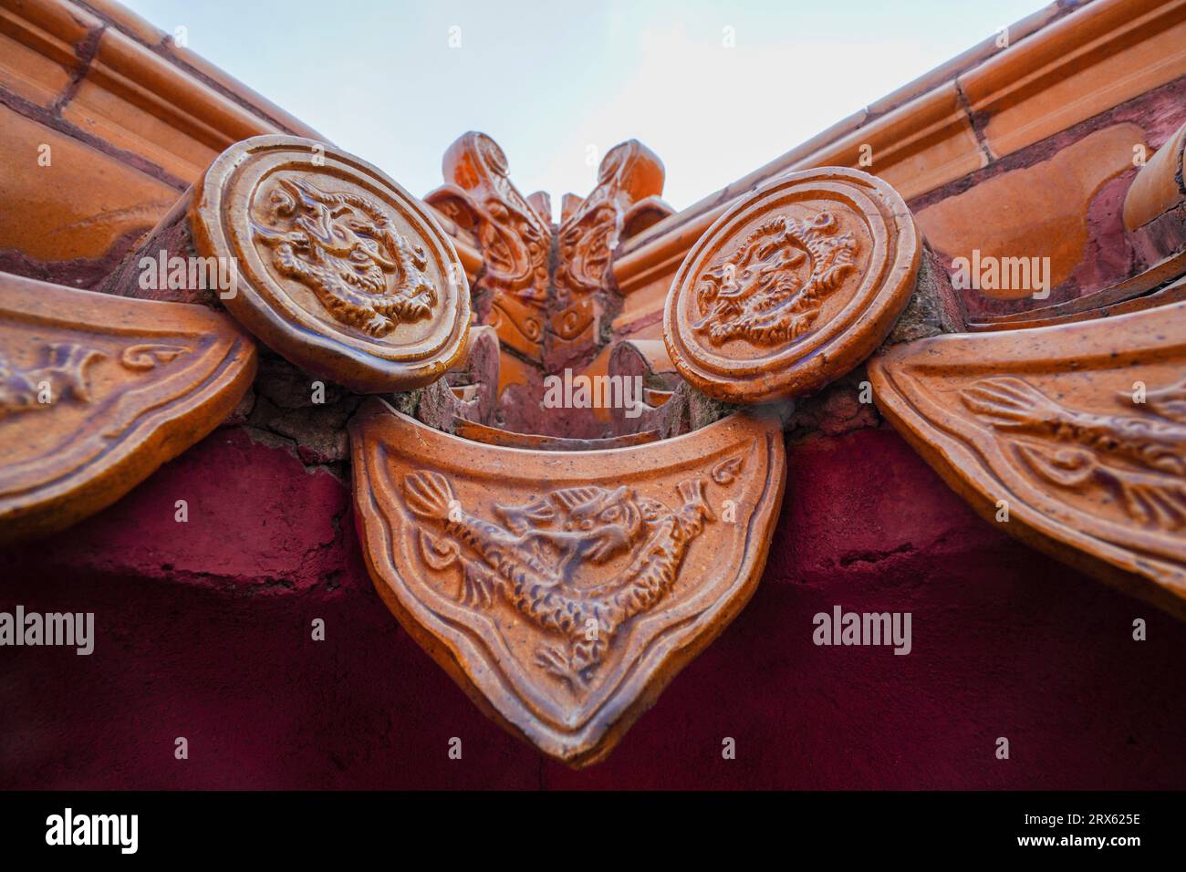 Yellow Chinese glazed roof tile dragon head architecture of Huangtangzi ...
