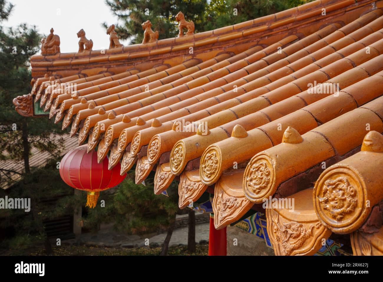 Yellow Chinese glazed roof tile buildings and red lanterns in ...