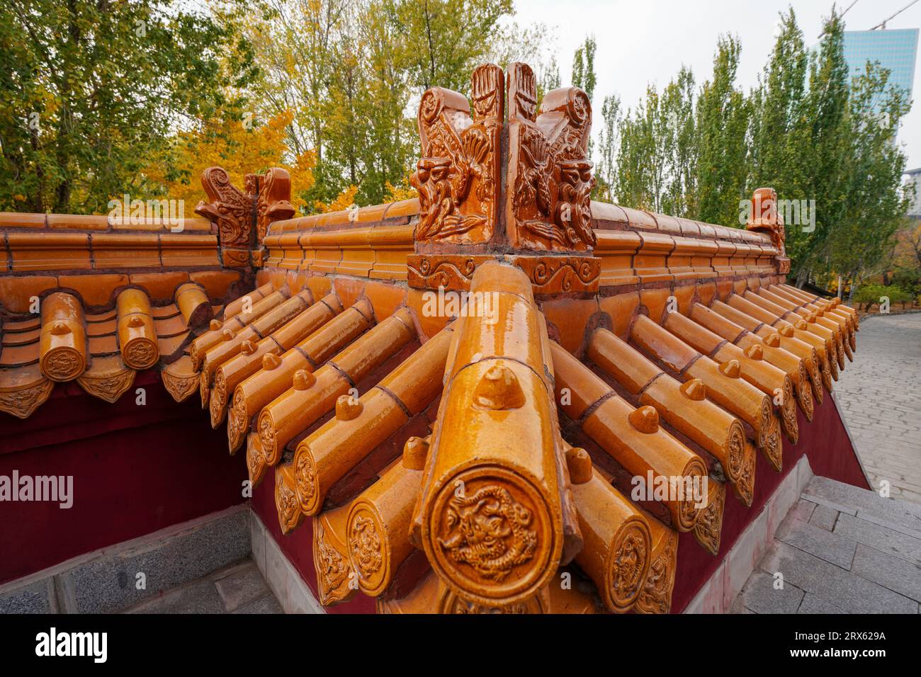 Yellow Chinese glazed roof tile dragon head architecture of Huangtangzi ...