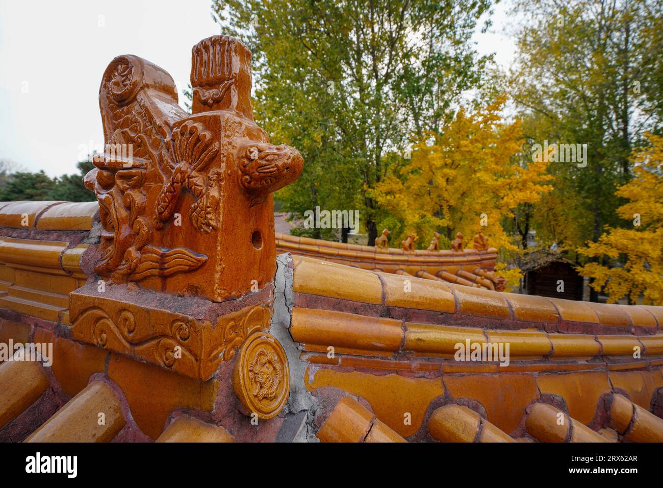 Yellow Chinese glazed roof tile dragon head architecture of Huangtangzi ...