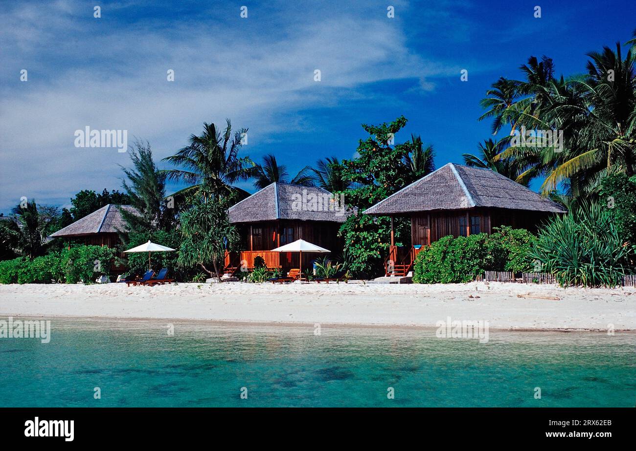 Tropical beach and beach bungalows, Wakatobi Dive Resort, Sulawesi ...