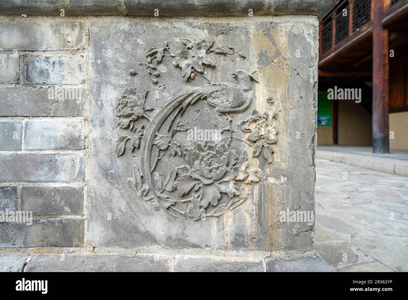 Brick carvings on the wall of the flower bed of the Salar people Museum ...