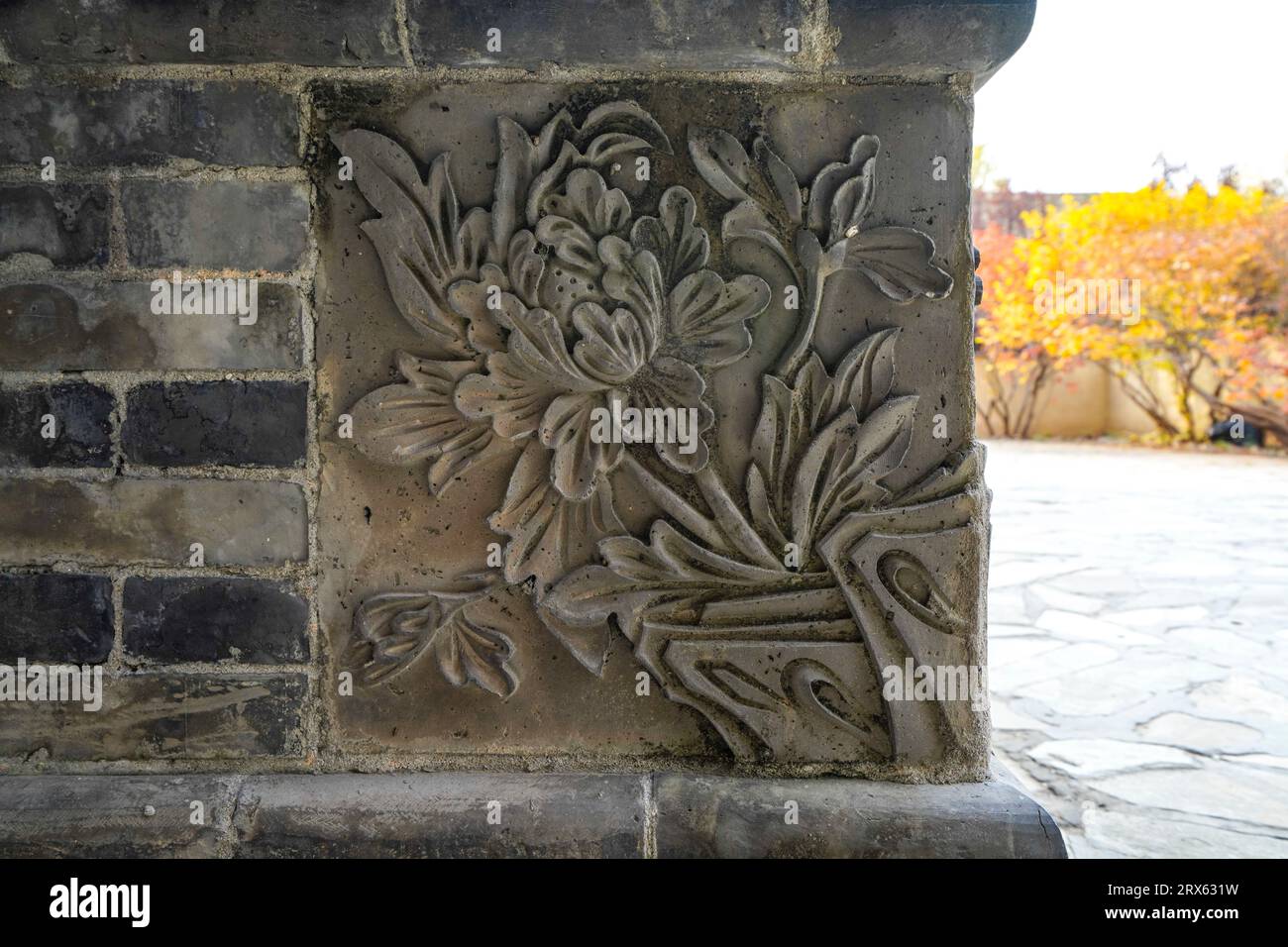 Brick carvings on the wall of the flower bed of the Salar people Museum ...