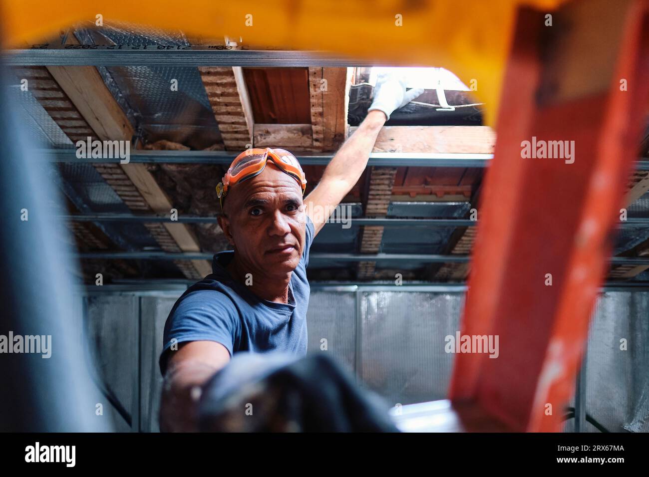 Mature construction worker repairing hi-res stock photography and ...