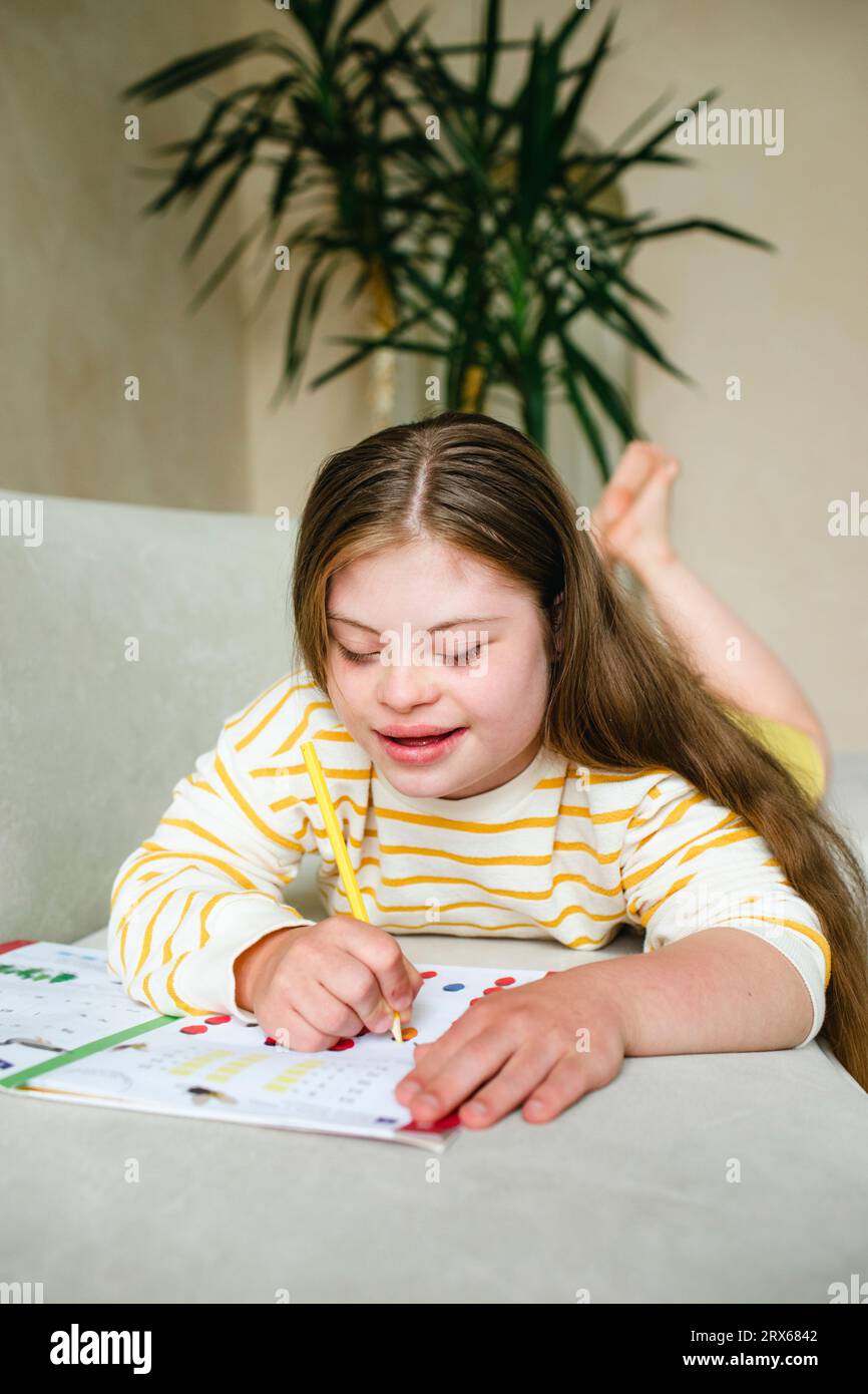 Down syndrome girl learning hi-res stock photography and images - Alamy