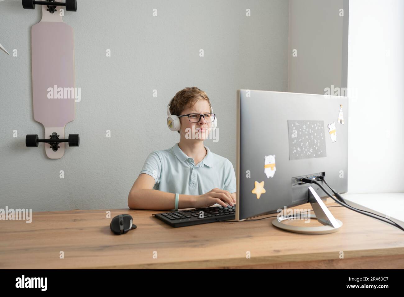 Boy playing computer game at home Stock Photo - Alamy