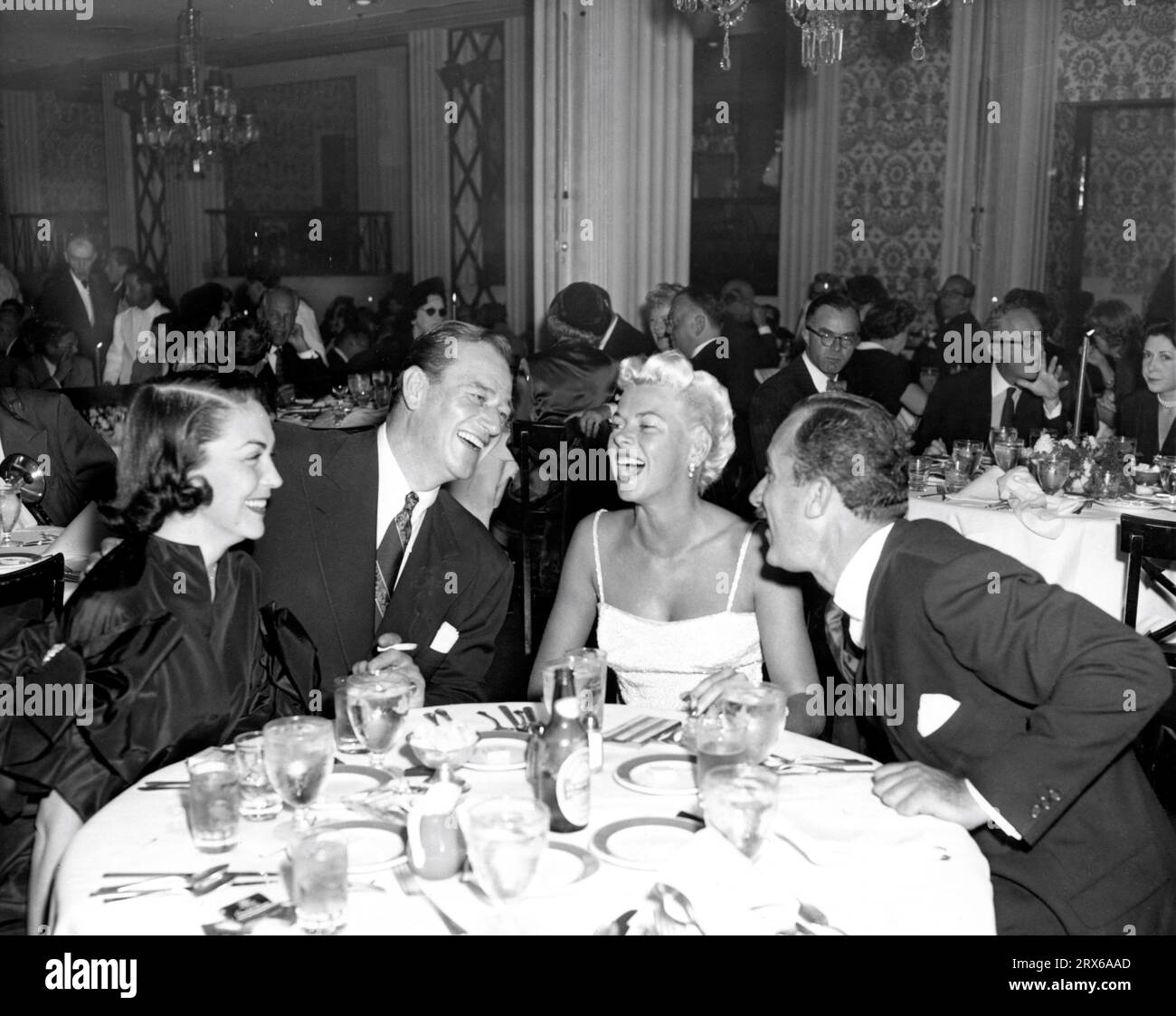 JOHN WAYNE and his Mexican second wife ESPERANZA BAUR with KEENAN WYNN ...