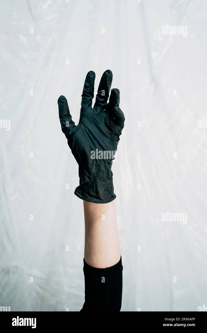Female hand wearing glove hi-res stock photography and images - Alamy