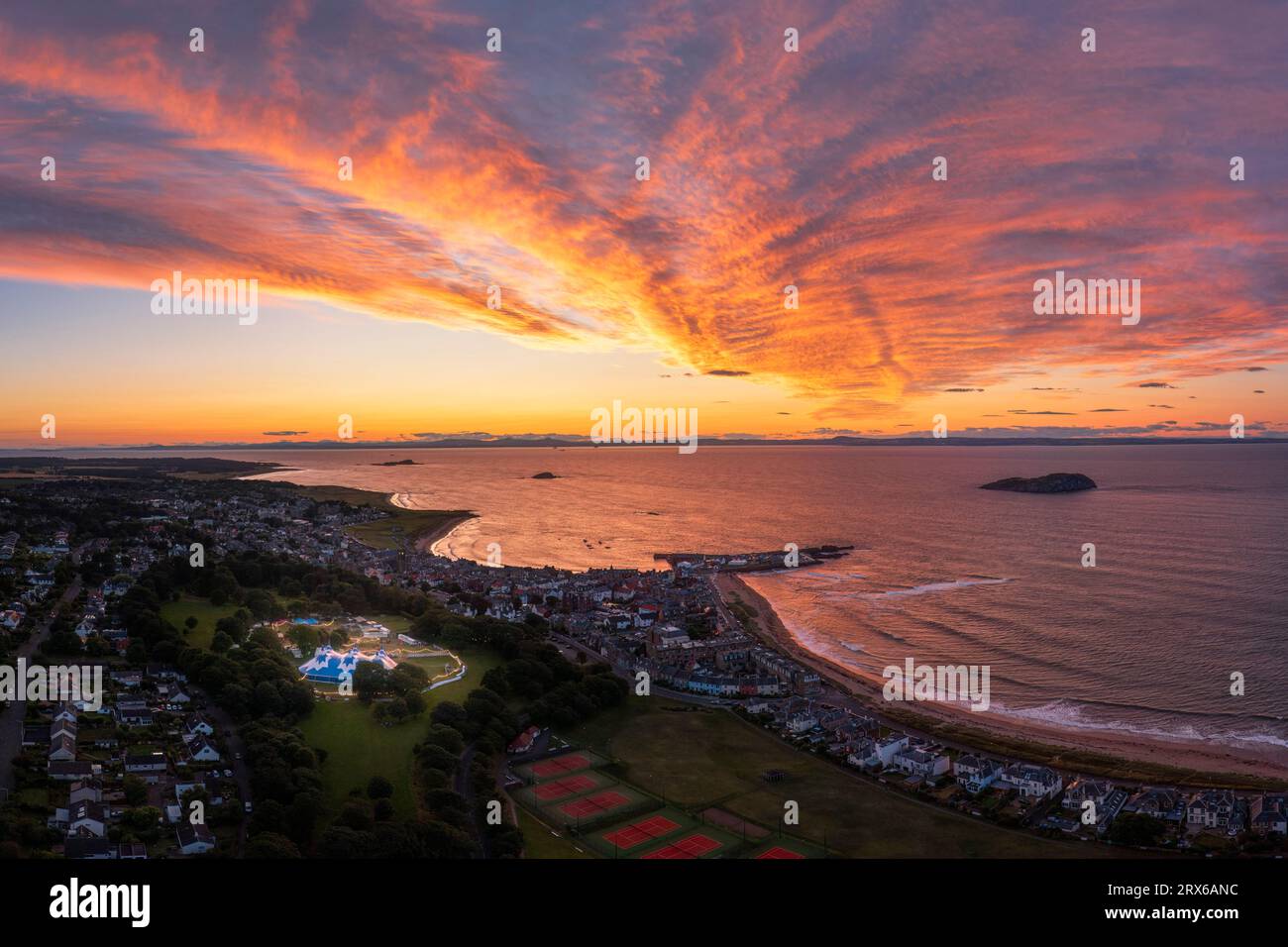 UK, Scotland, North Berwick, Aerial view of seaside town at sunset ...