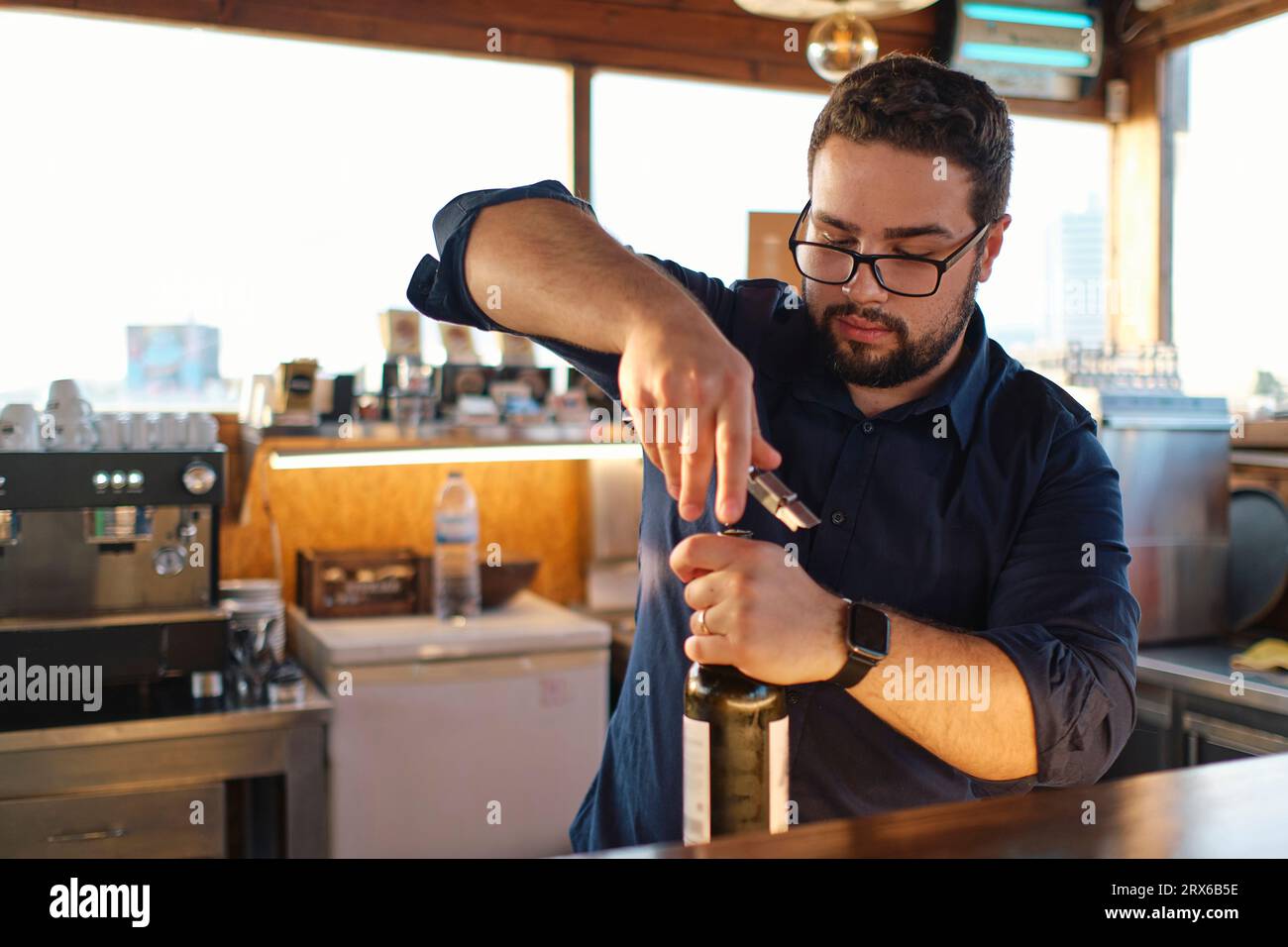 Young male bartender bottle hi-res stock photography and images - Alamy