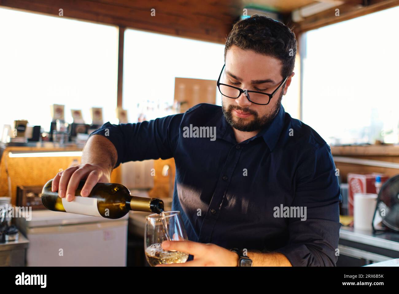 Young bartender hi-res stock photography and images - Alamy