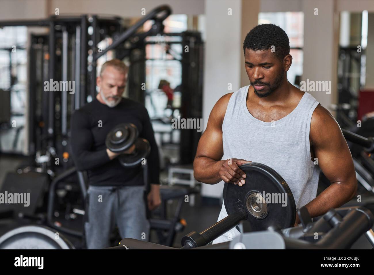 Adding weight hi-res stock photography and images - Alamy