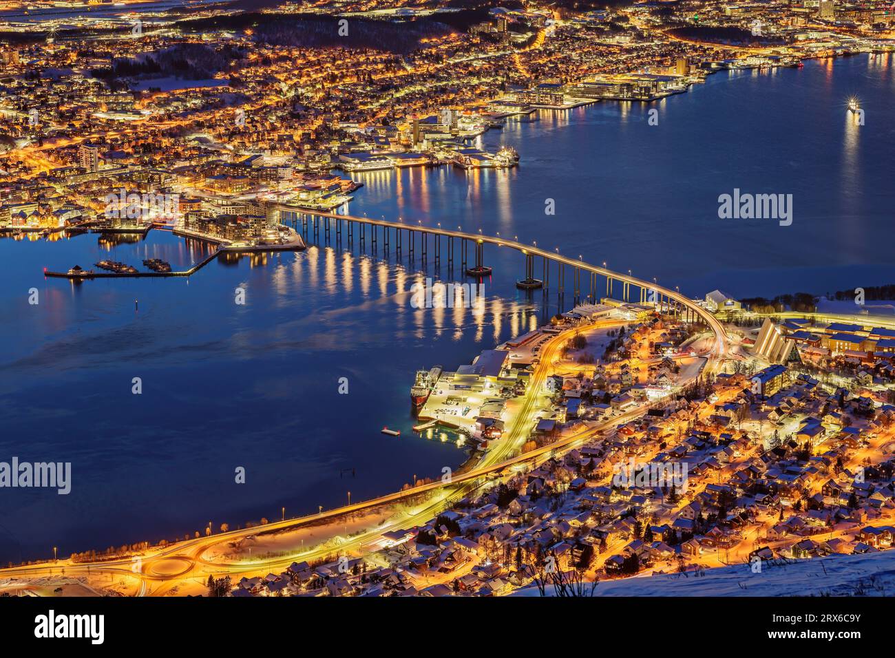 Norway, Troms og Finnmark, Tromso, Long exposure of illuminated city ...