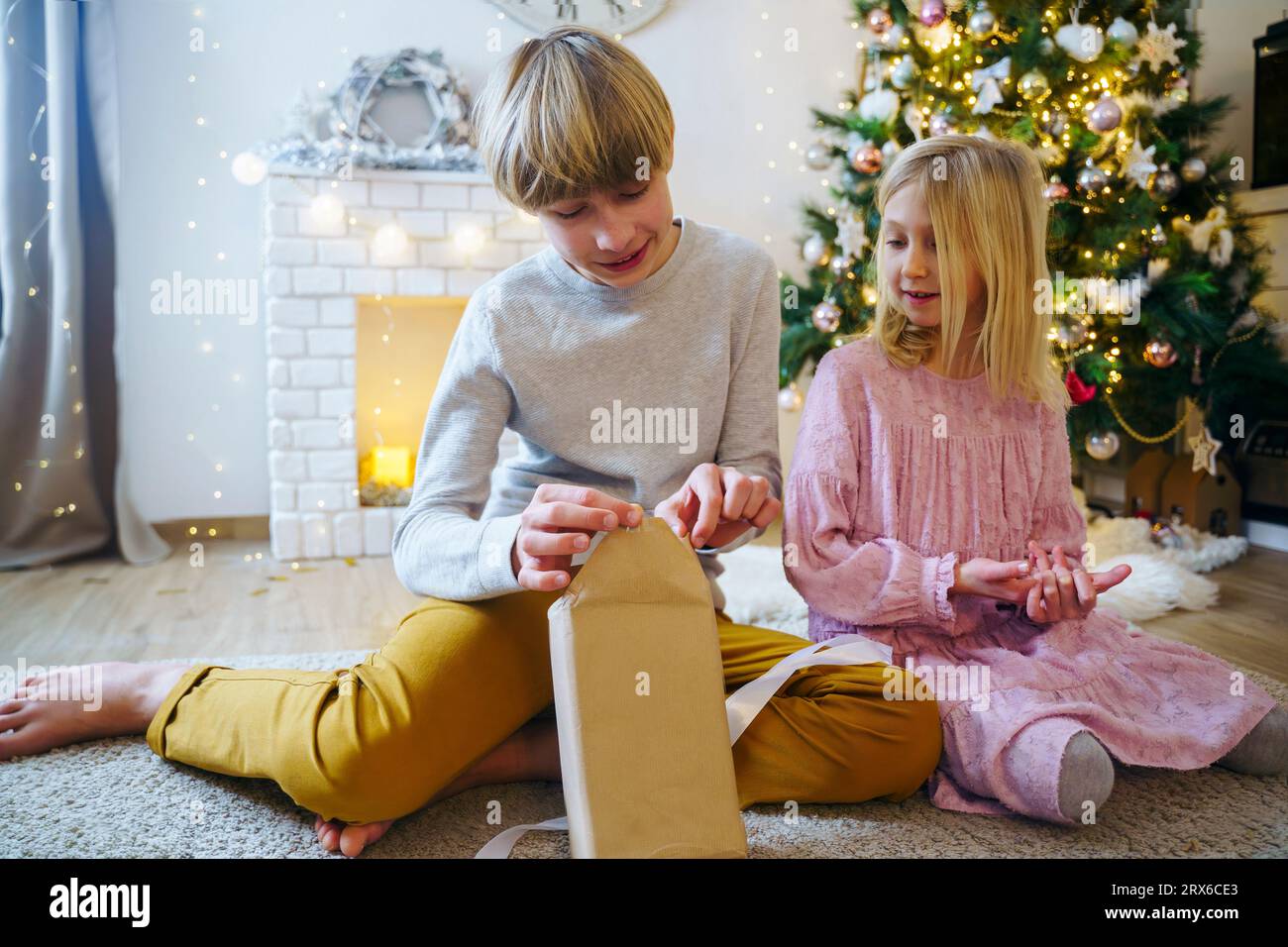Child opening present hi-res stock photography and images - Alamy