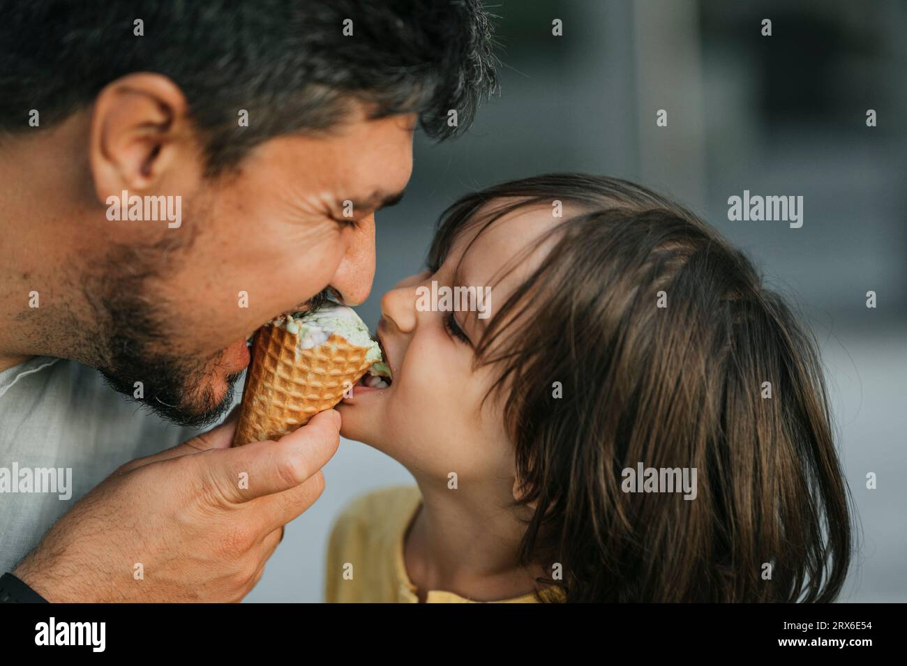 Two children sharing ice cream hi-res stock photography and images - Alamy