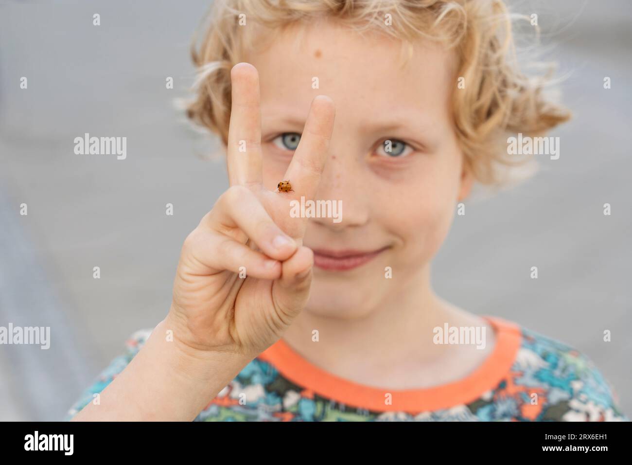 Boy looking at sign hi-res stock photography and images - Alamy