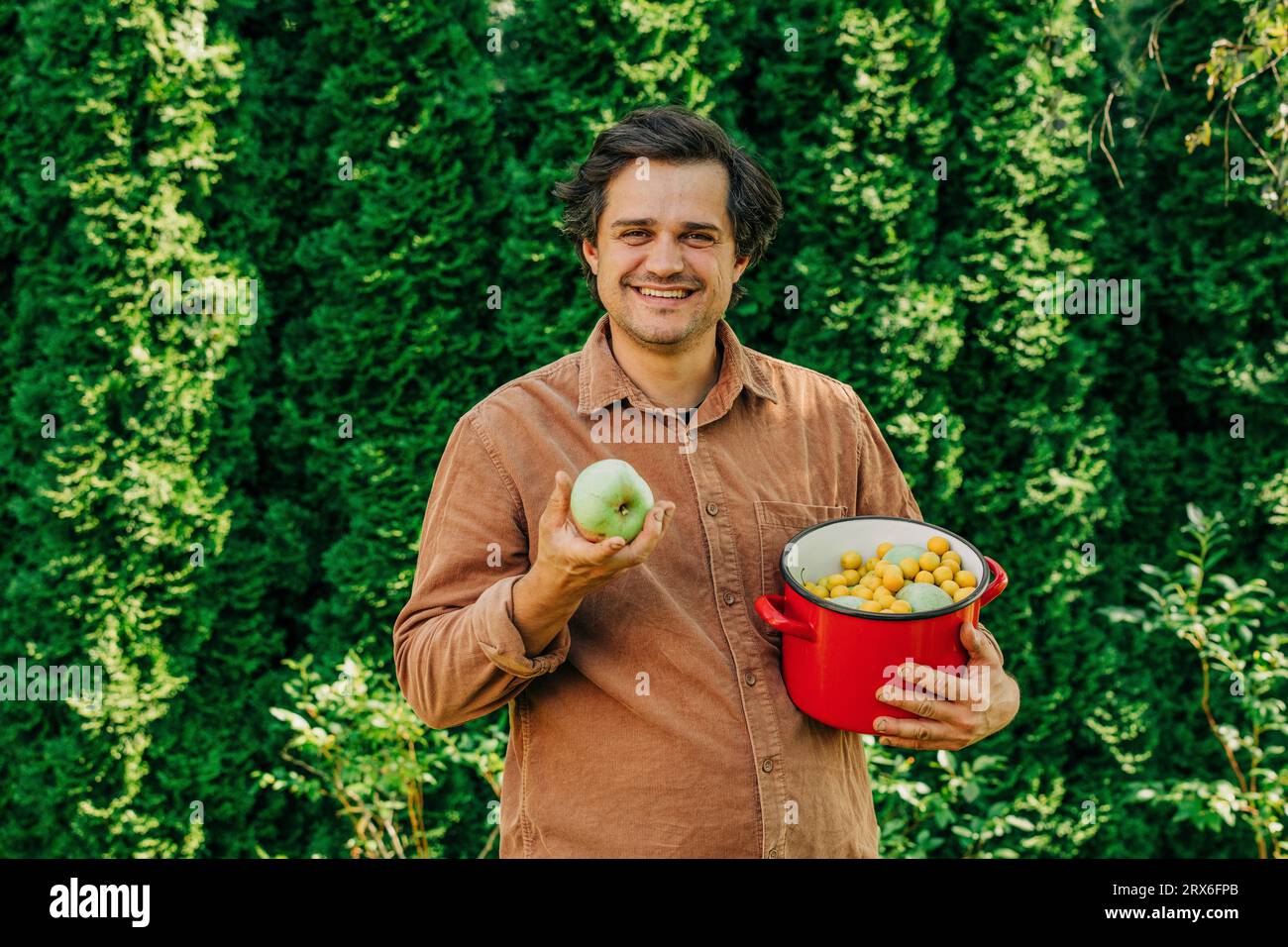 Person carrying pot of food hi-res stock photography and images - Alamy