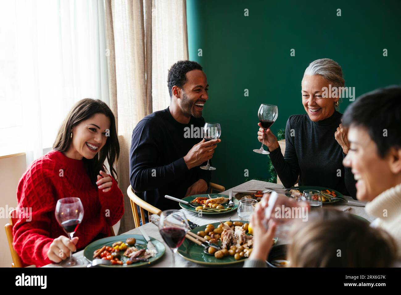Happy family having dinner party hi-res stock photography and images ...