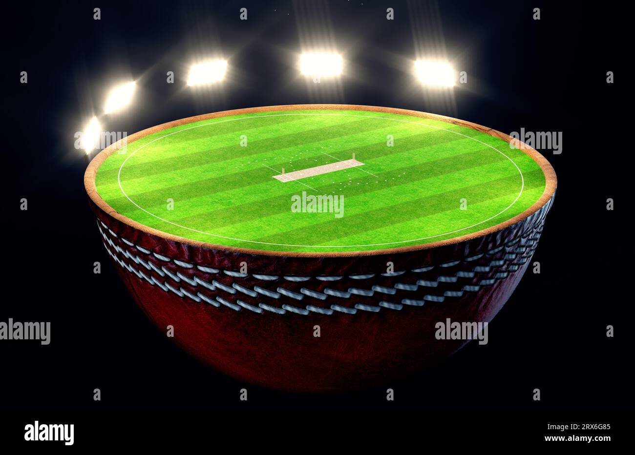 A cricket ball split in half revealing a marked green grass cricket ...