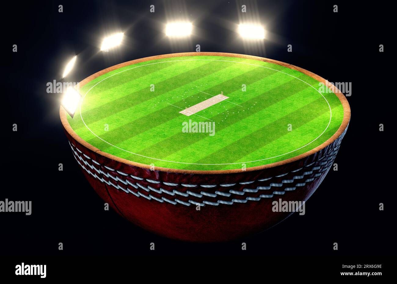 A cricket ball split in half revealing a marked green grass cricket ...