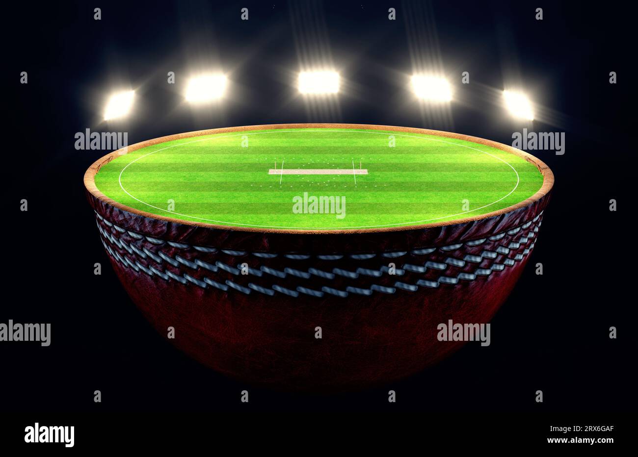 A cricket ball split in half revealing a marked green grass cricket ...