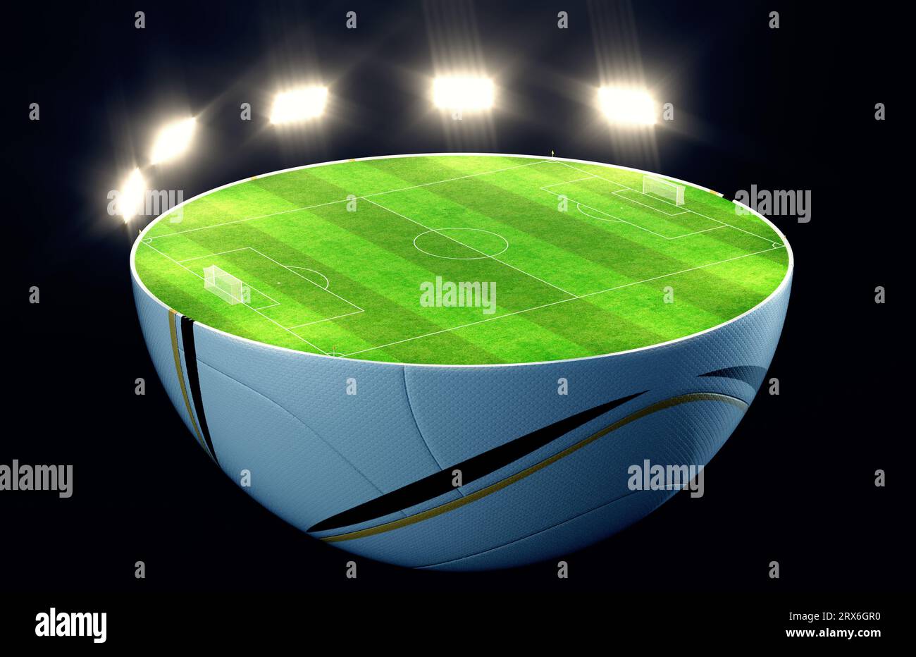 A soccer ball split in half revealing a marked green grass football ...