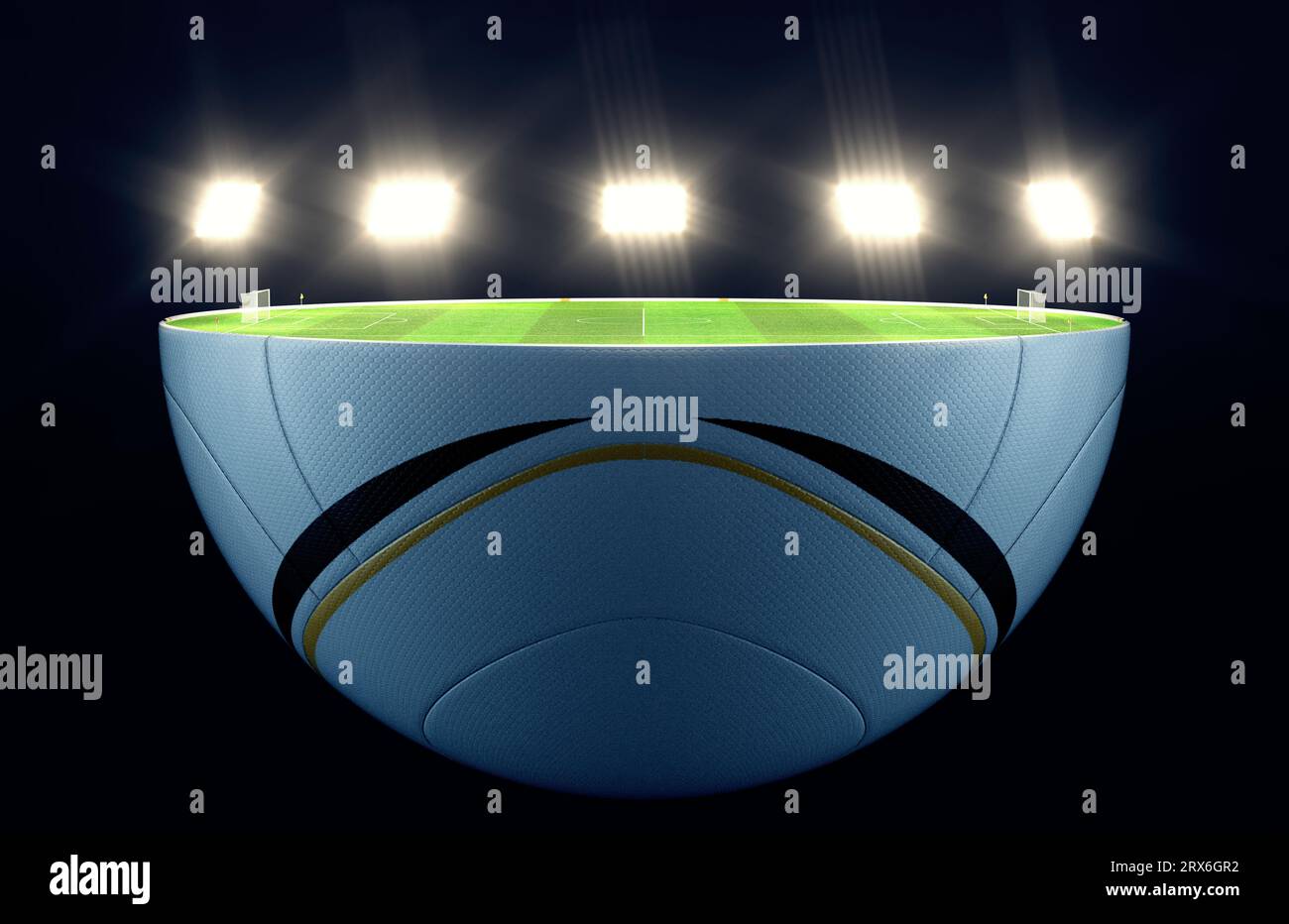 A soccer ball split in half revealing a marked green grass football ...