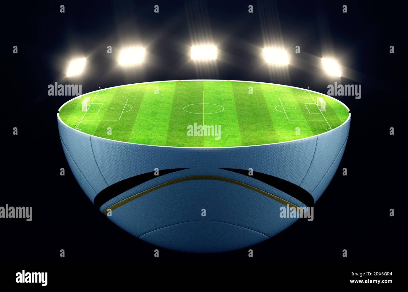 A soccer ball split in half revealing a marked green grass football ...