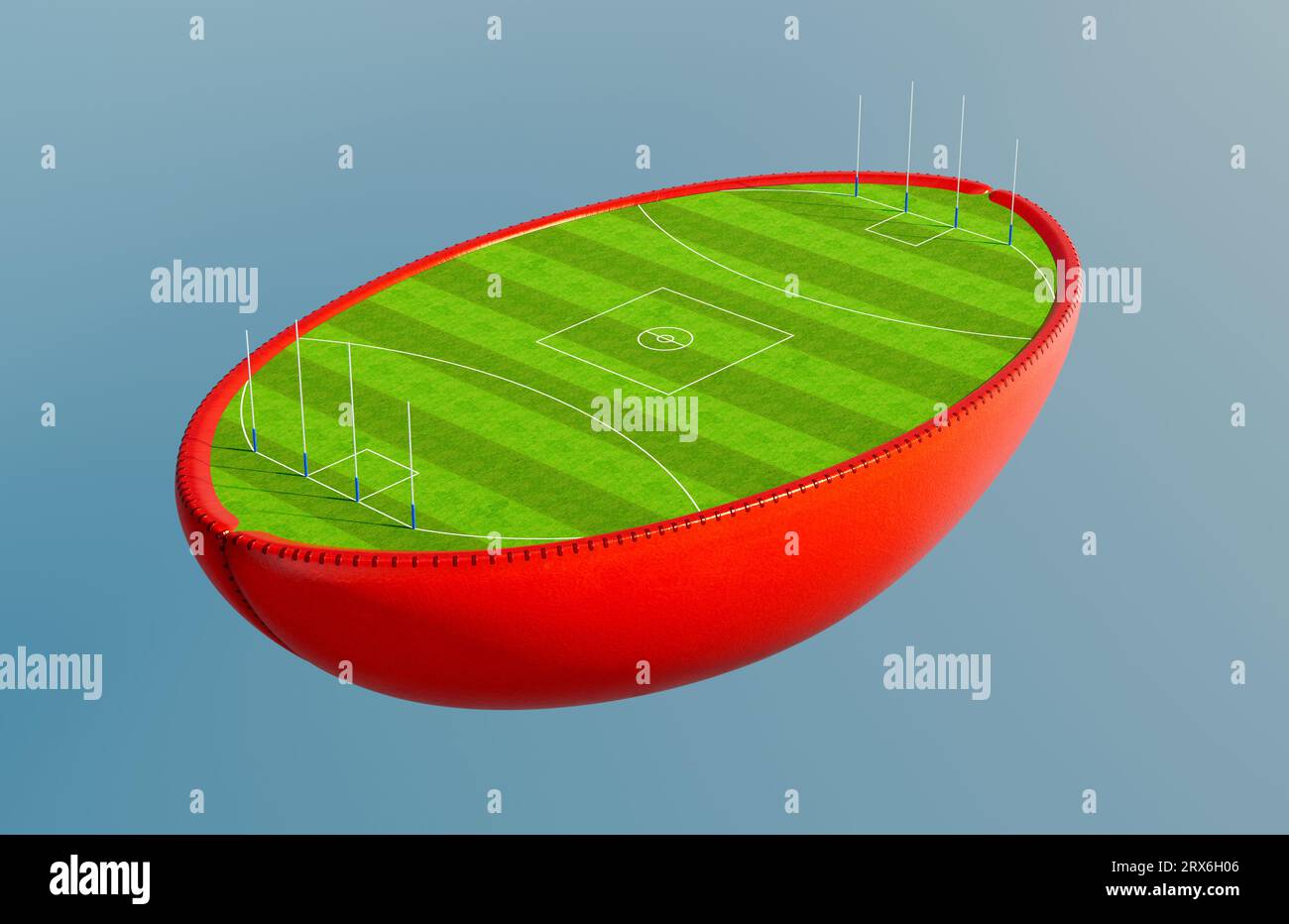 An ausralian rules ball split in half revealing a marked green grass ...