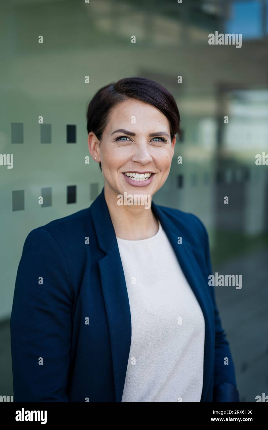 Happy businesswoman wearing smart casual Stock Photo - Alamy