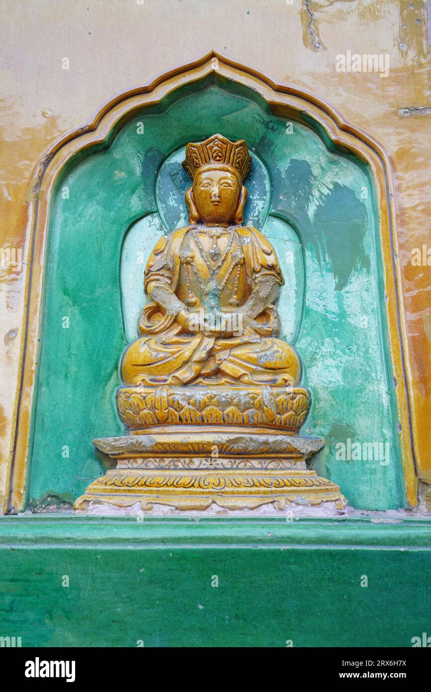 Beijing China, November 10, 2022: glazed Buddha on the wall of the ...