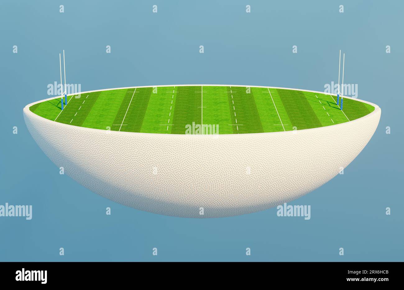 A rugby ball split in half revealing a marked green grass rugby pitch ...