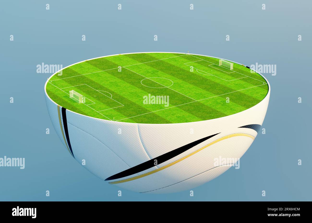 A soccer ball split in half revealing a marked green grass football ...