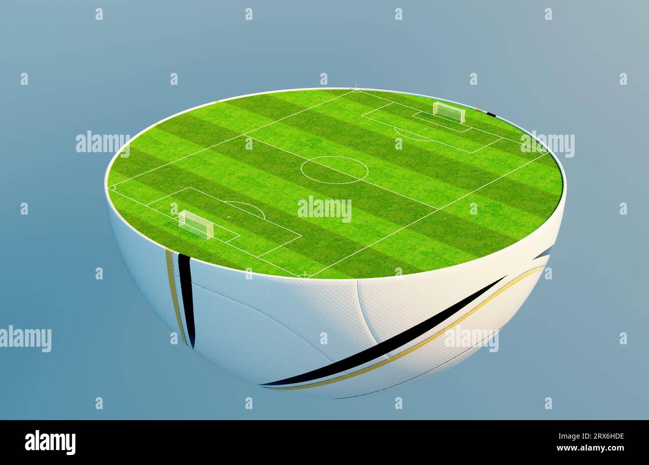 A soccer ball split in half revealing a marked green grass football ...