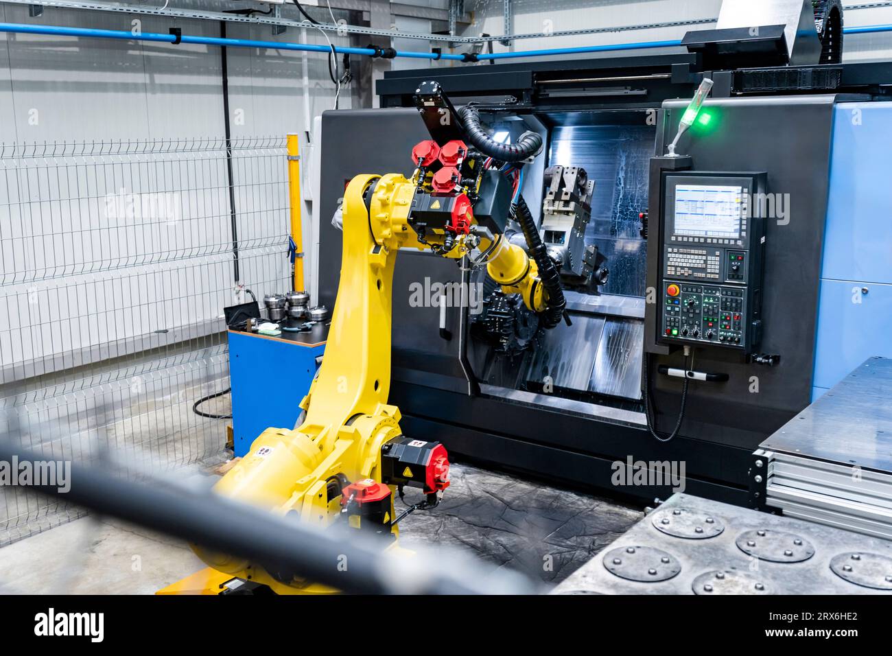 Robotic arm with machinery in factory Stock Photo - Alamy