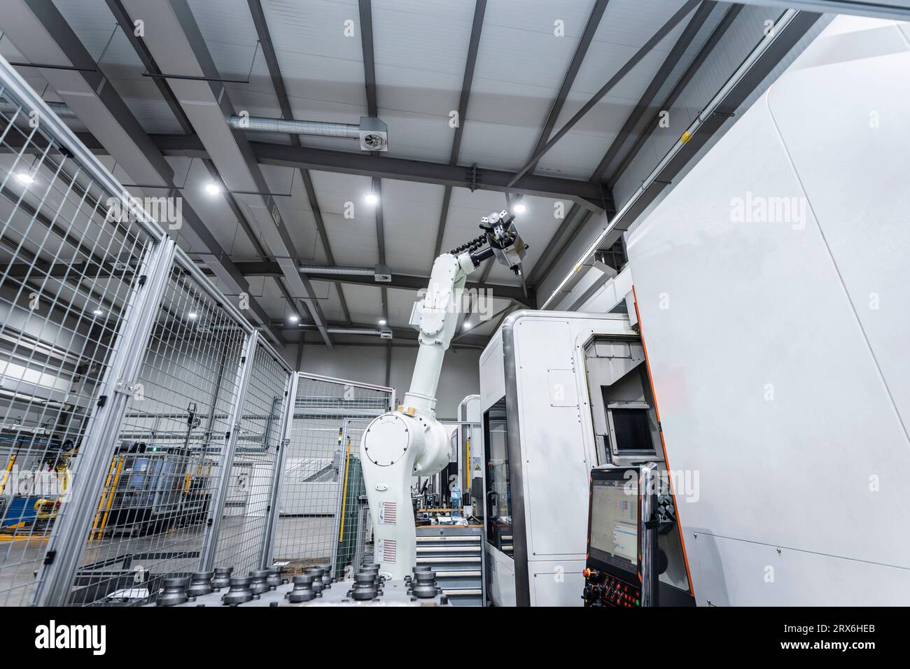 Robotic arm with cnc machinery in factory Stock Photo - Alamy