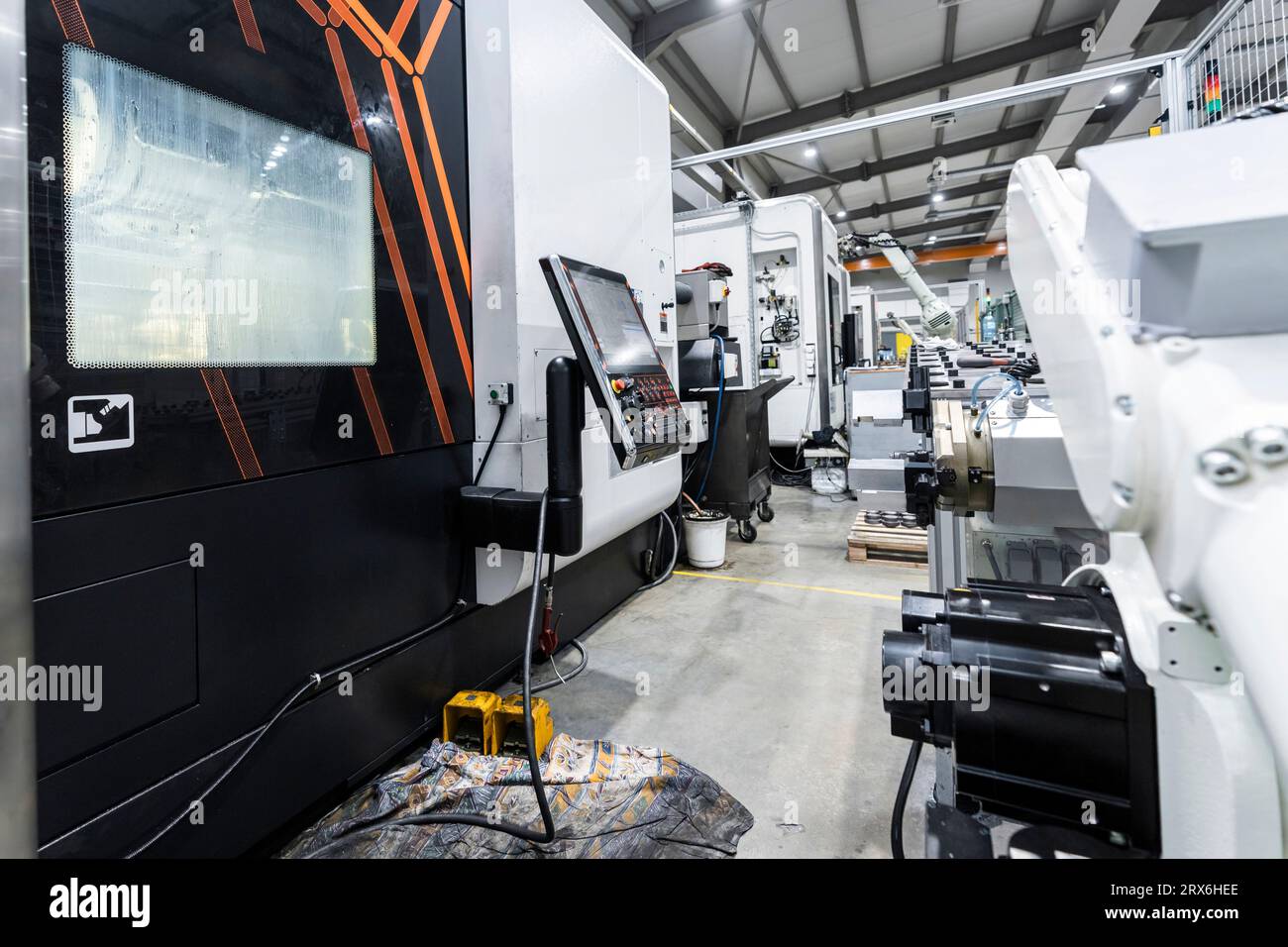 Cnc machinery with robotics in industry Stock Photo - Alamy