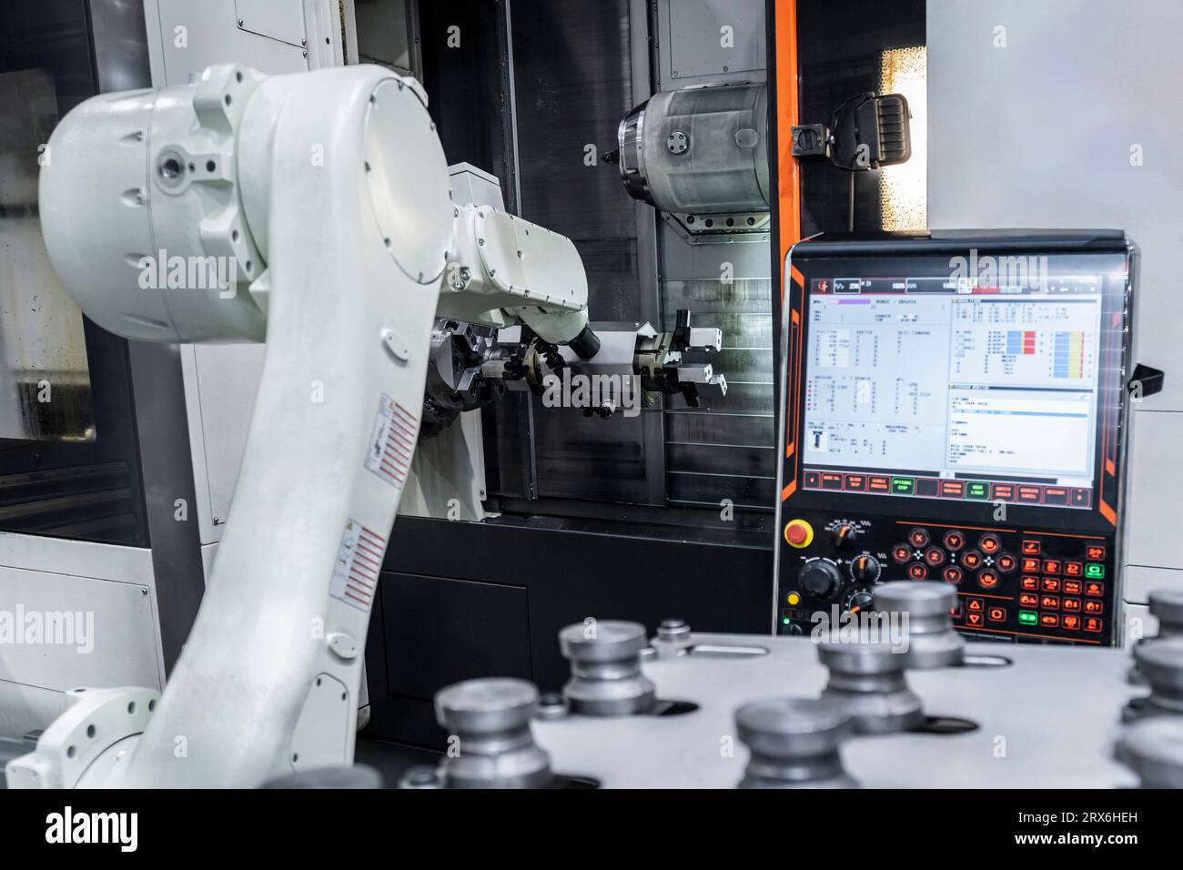 Robotic arm with cnc machinery in metal factory Stock Photo - Alamy