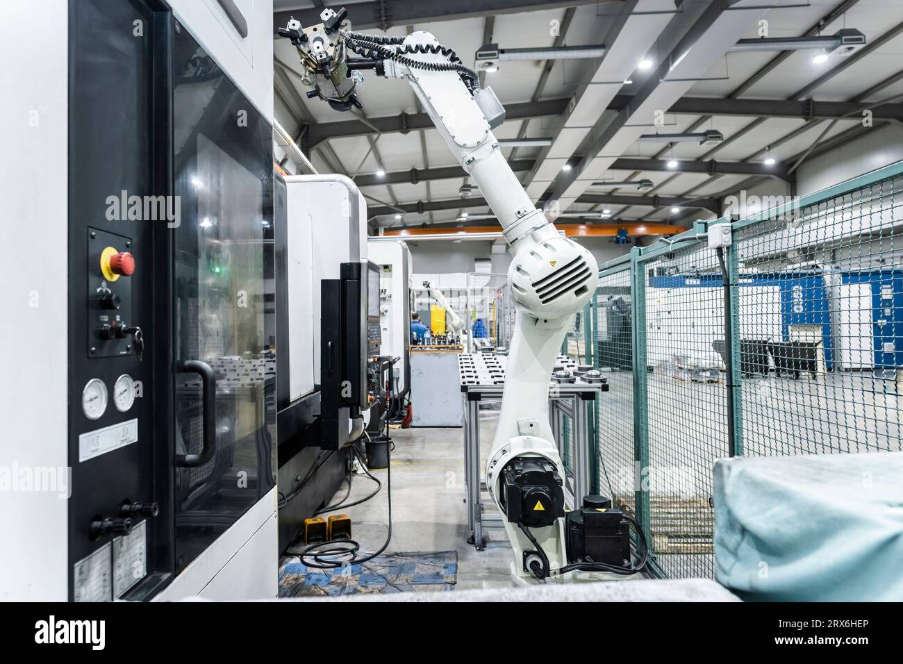 White robotic arm with cnc machinery Stock Photo - Alamy