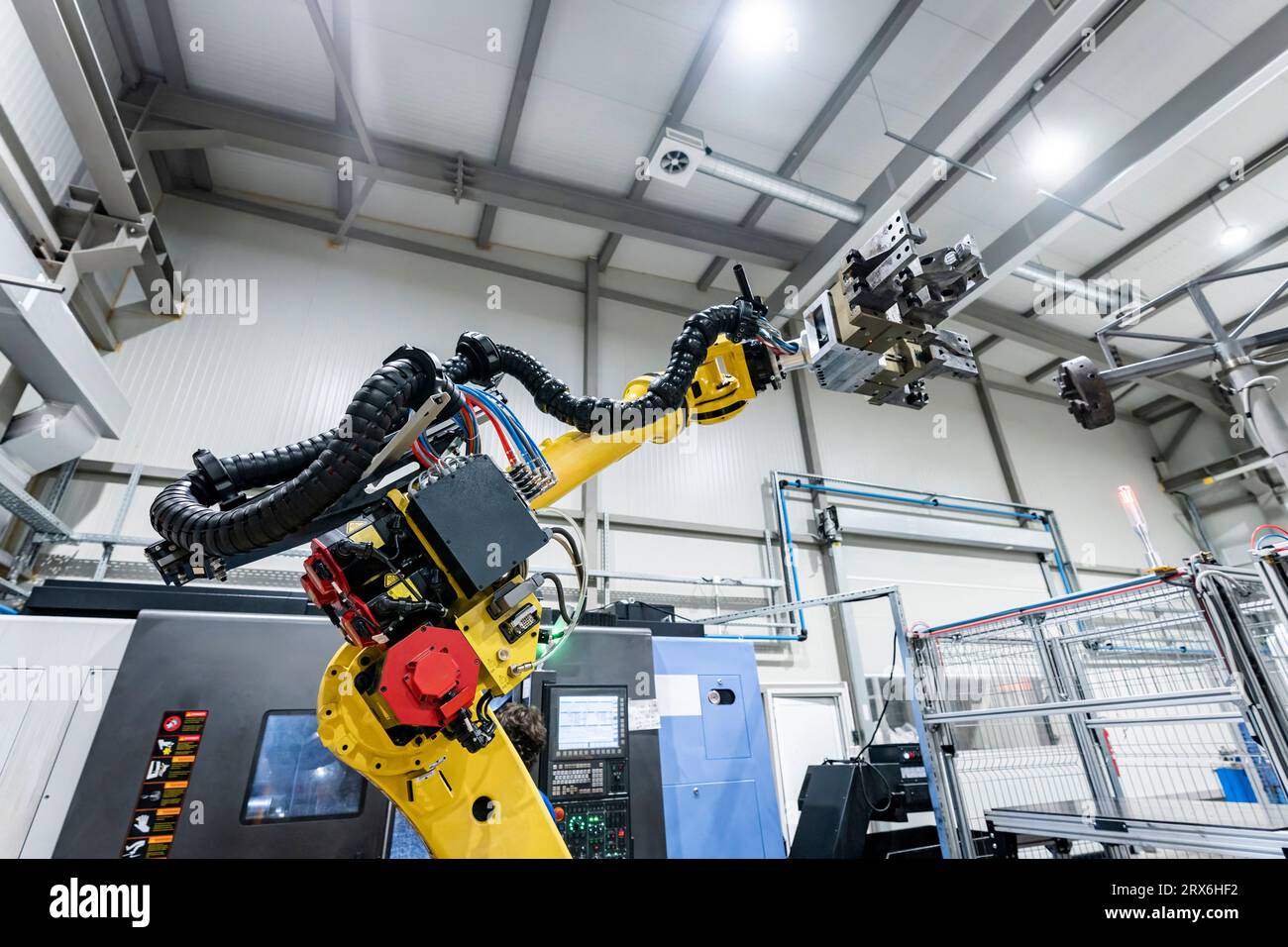 Automated robotic arm with cnc machinery Stock Photo - Alamy