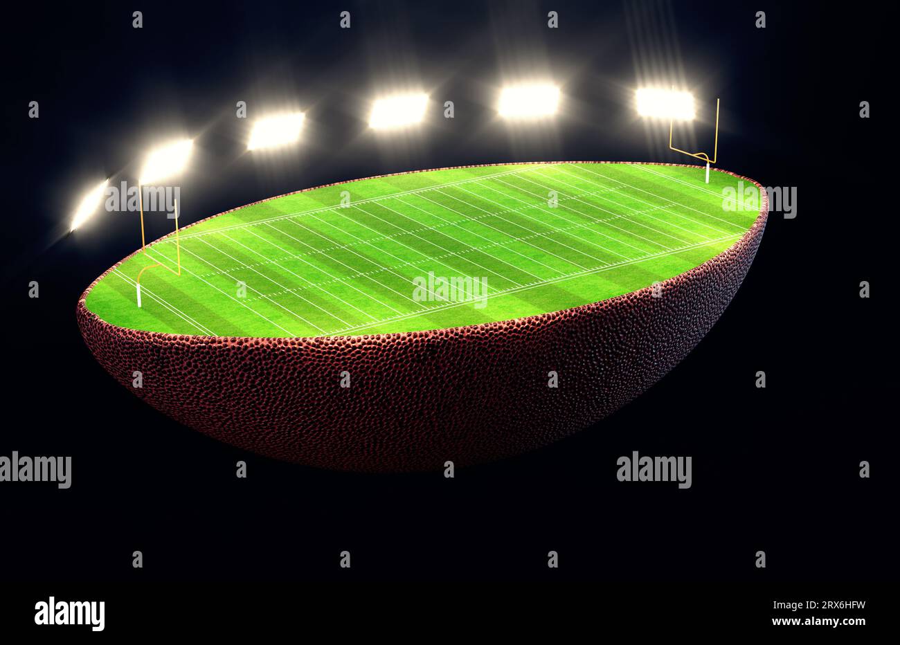 An american football ball split in half revealing a marked green grass ...
