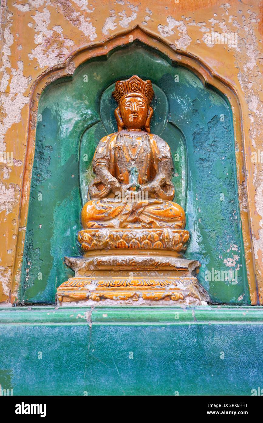Beijing China, November 10, 2022: glazed Buddha on the wall of the ...