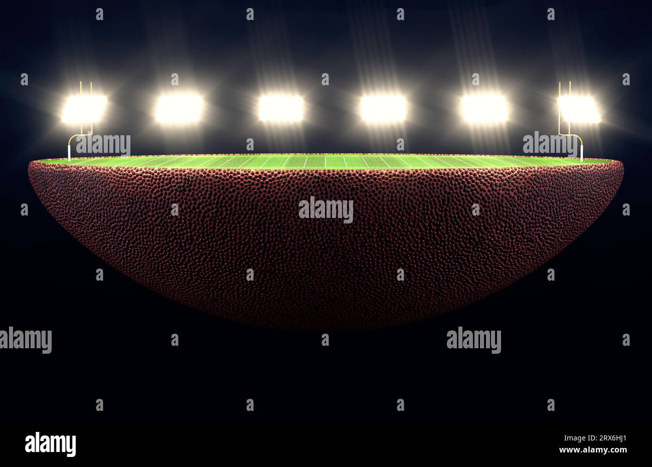 An american football ball split in half revealing a marked green grass ...